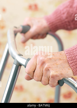 Woman hand holding and using a hand grip strengthener on a white ...