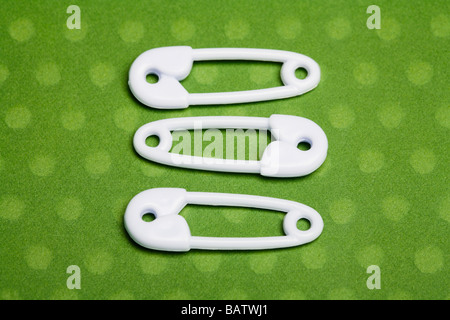Three safety pins Stock Photo - Alamy