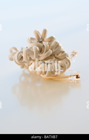 Studio shot of disconnected phone cord Stock Photo - Alamy