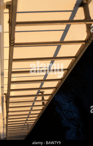Wall mount ladders from top to bottom Stock Photo - Alamy