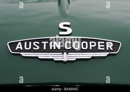 Austin Mini Cooper logo badge on red car in the rain close up Stock ...
