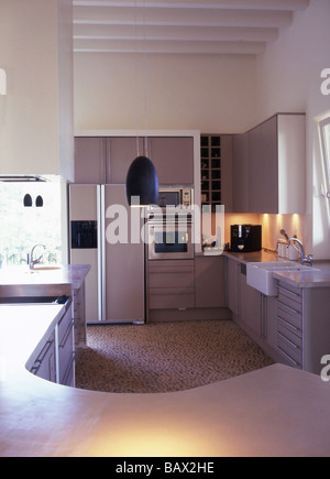 Bright modern Mediterranean villa kitchen with a dining table with ...