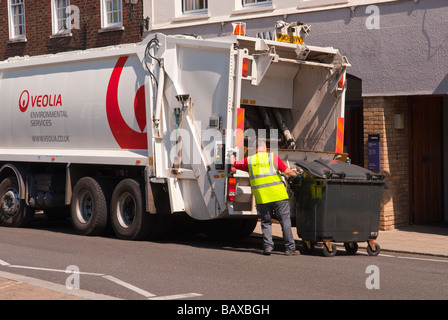 A bin lorry emptying an industrial wheely bin in Norwich , Norfolk ...