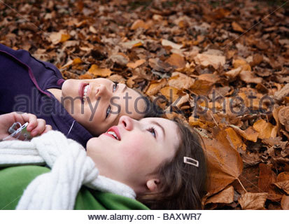 Young pre teen girl with mp3 player and phone indoors Stock Photo ...