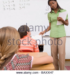 teacher giving test to student boy on lecture Stock Photo: 119466656 ...