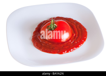 Tomato being smashed into ketchup Stock Photo - Alamy