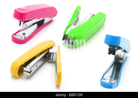 Colorful office staplers on white background Stock Photo - Alamy