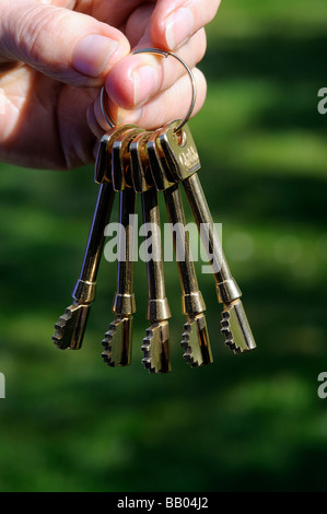 Bunch of brass coloured colored Chubb keys Stock Photo - Alamy