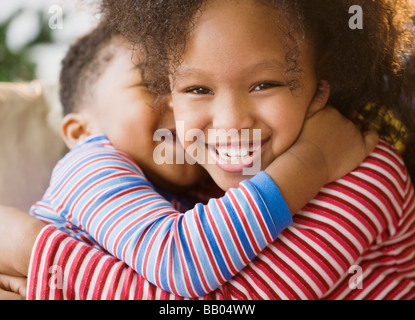 close up portrait of brother and sister hugging in autumnal park Stock ...