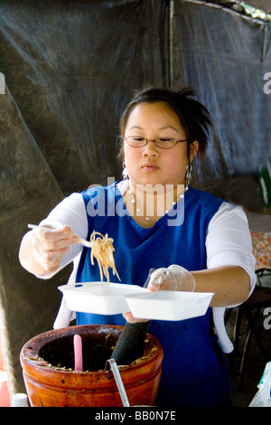 Hmong festival concession stand serving multicolored fruit drinks ...
