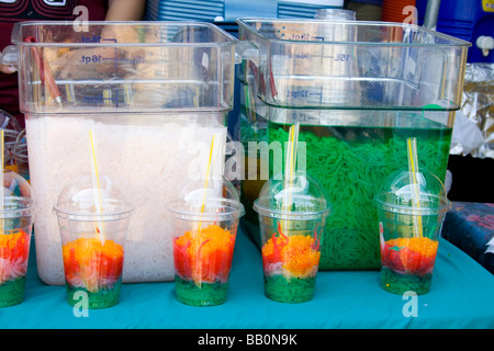 Hmong festival concession stand serving multicolored fruit drinks ...