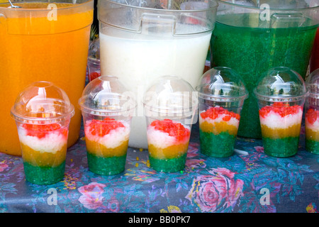Hmong festival concession stand serving multicolored fruit drinks ...
