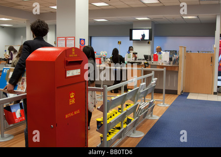 Counter service at a modern Post Office UK Stock Photo - Alamy