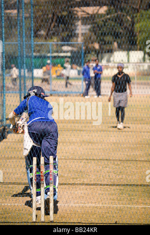 Female cricketer bowling Stock Photo - Alamy
