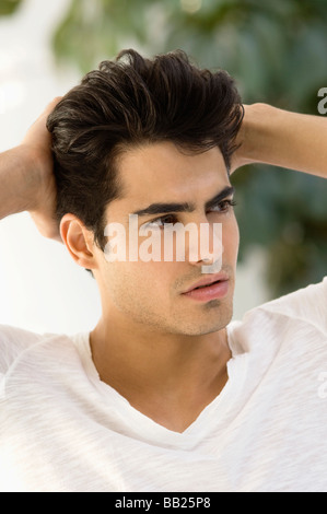 Hispanic man with casual clothing thinking and looking away Stock Photo ...