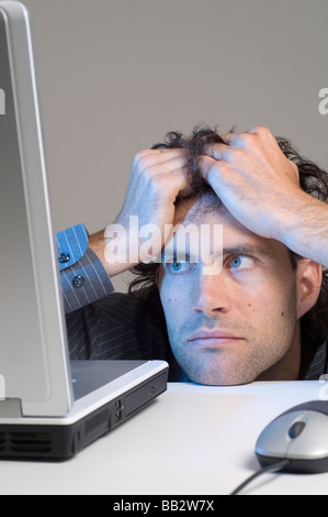 Stressed Office worker Pulling his hair out Stock Photo - Alamy