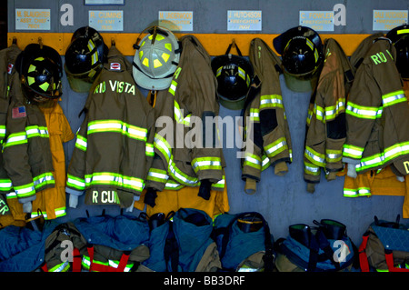 Modern firefighter in gear with equipment isolated on a white ...