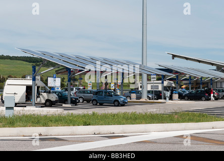 Solar panels used to simultaneously shade parked cars and to generate ...