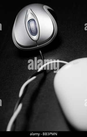 Computer mouse cord tied together Stock Photo - Alamy