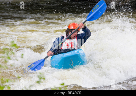 USA, Colorado, Frisco. Male competitor in Kayak Rodeo on Ten-Mile Creek ...