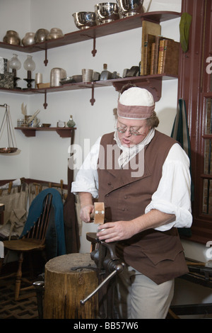 The silversmith at Colonial Williamsburg, Virginia, handcrafts jewelry ...