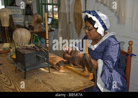 A woman makes a wig in the Barber & Peruke Maker Shop at Colonial ...
