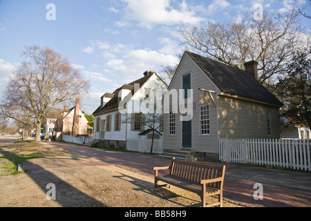 Colonial-style houses, including a tailor's shop, line the streets of ...