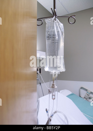 Intravenous saline drip bag hanging Stock Photo - Alamy