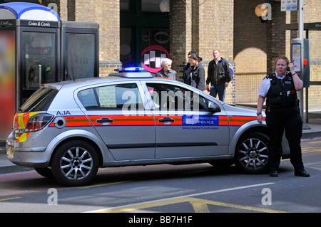 Metropolitan Police WPC woman officer in a Police station custody suite ...