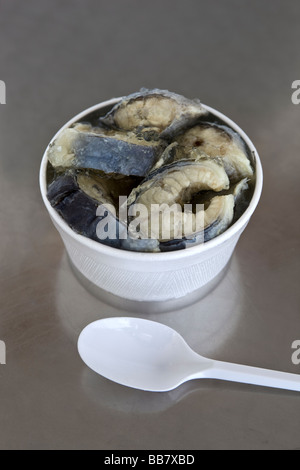 Tub Of Jellied Eels with a Spoon Stock Photo - Alamy