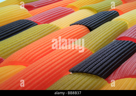 Multi-coloured Penne pasta in tomato sauce Stock Photo - Alamy