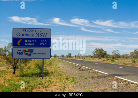 A sign welcoming people to Outback New South Wales on the border with ...