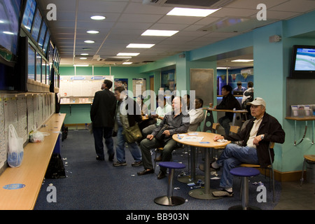 Gambling UK, Bookies betting shop 1970s interior people placing bets ...
