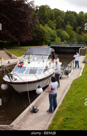 River Thames with river craft passing through the lock at Shepperton on ...