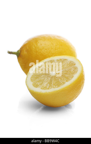 Whole and halved fresh Citrus limon Rosso, Red lemon, close up isolated ...