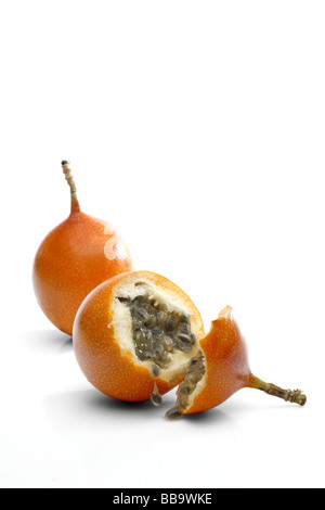 Half and whole granadilla passion fruit isolated on white background ...