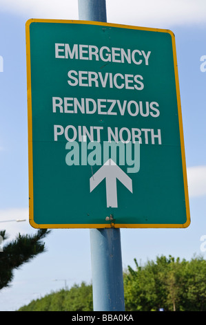 Sign for the emergency services rendezvous point and a notice to ...
