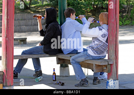 three teenage boys drinking alcohol Stock Photo - Alamy