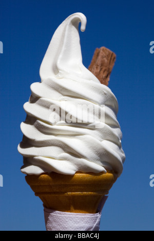 Ninety Nine ice cream cone with raspberry against blues sky and sea. UK ...