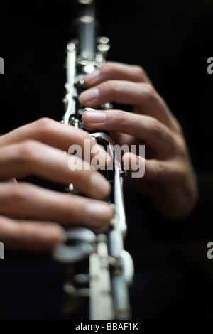 Hands Holding Clarinet Stock Photo - Alamy