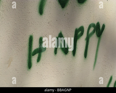 the word happy painted graffiti on banner in city town Stock Photo - Alamy