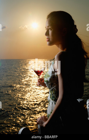 Person looking out over the ocean Stock Photo - Alamy