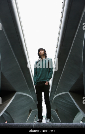 young man under freeway overpass Stock Photo - Alamy