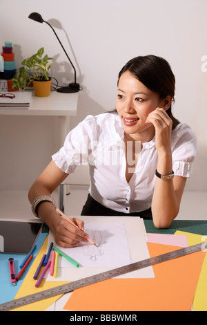 Young chinese woman tailor smiling confident standing with arms crossed ...