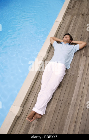 Young Black man reclining with eyes closed and serene expression Stock ...