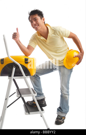 Carpenter giving the thumbs up Stock Photo - Alamy