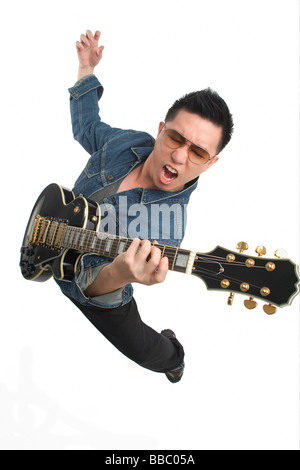 Adult guitarist enthusiastically playing guitar Stock Photo - Alamy