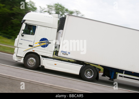 Side view white hgv haulage lorry truck cab & driver flatbed ...