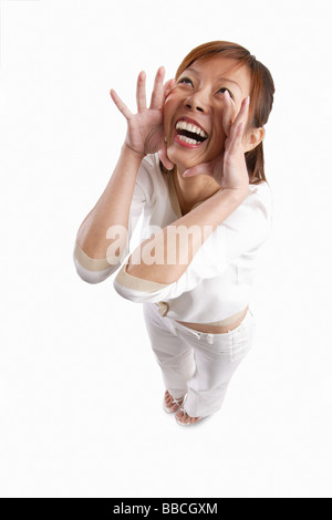 asian woman shouting with smiling face Stock Photo - Alamy