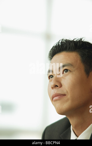 Young business man looking up Stock Photo - Alamy